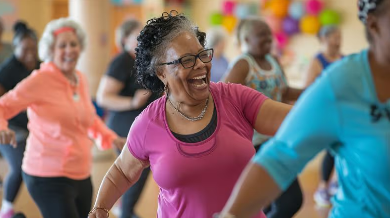 Lady dancing at Zumba - ActiveKent